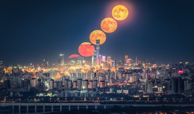 The moon rises above Beijing by Yuan Cui