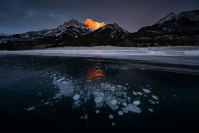 Sun rise on ice bubble lake by Songlin Xu